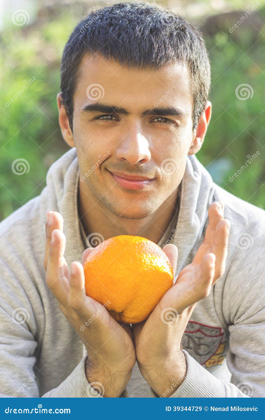 Man holding an orange stock image. Image of portrait - 39344729