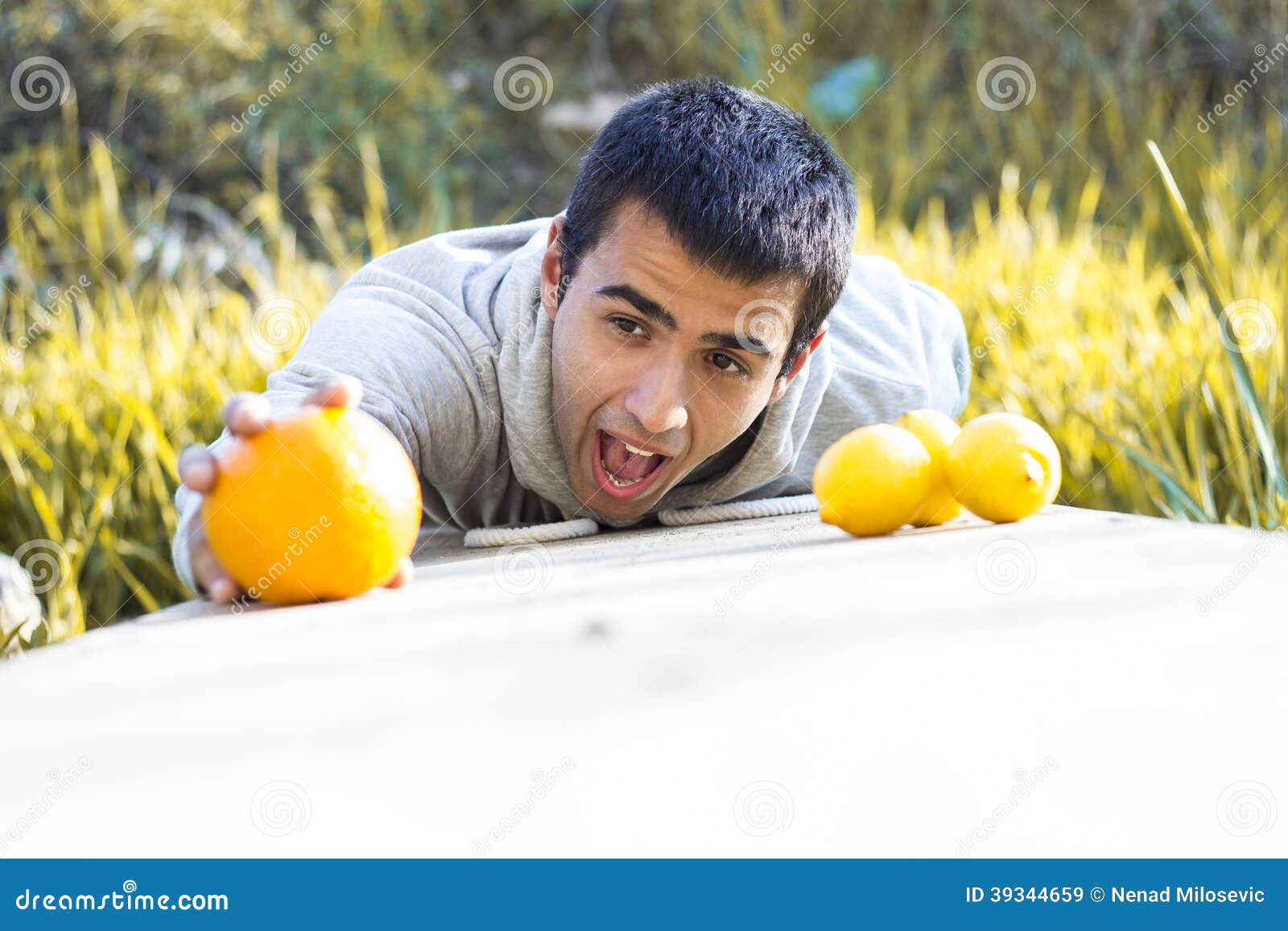 Man holding an orange stock image. Image of sales, lemon - 39344659