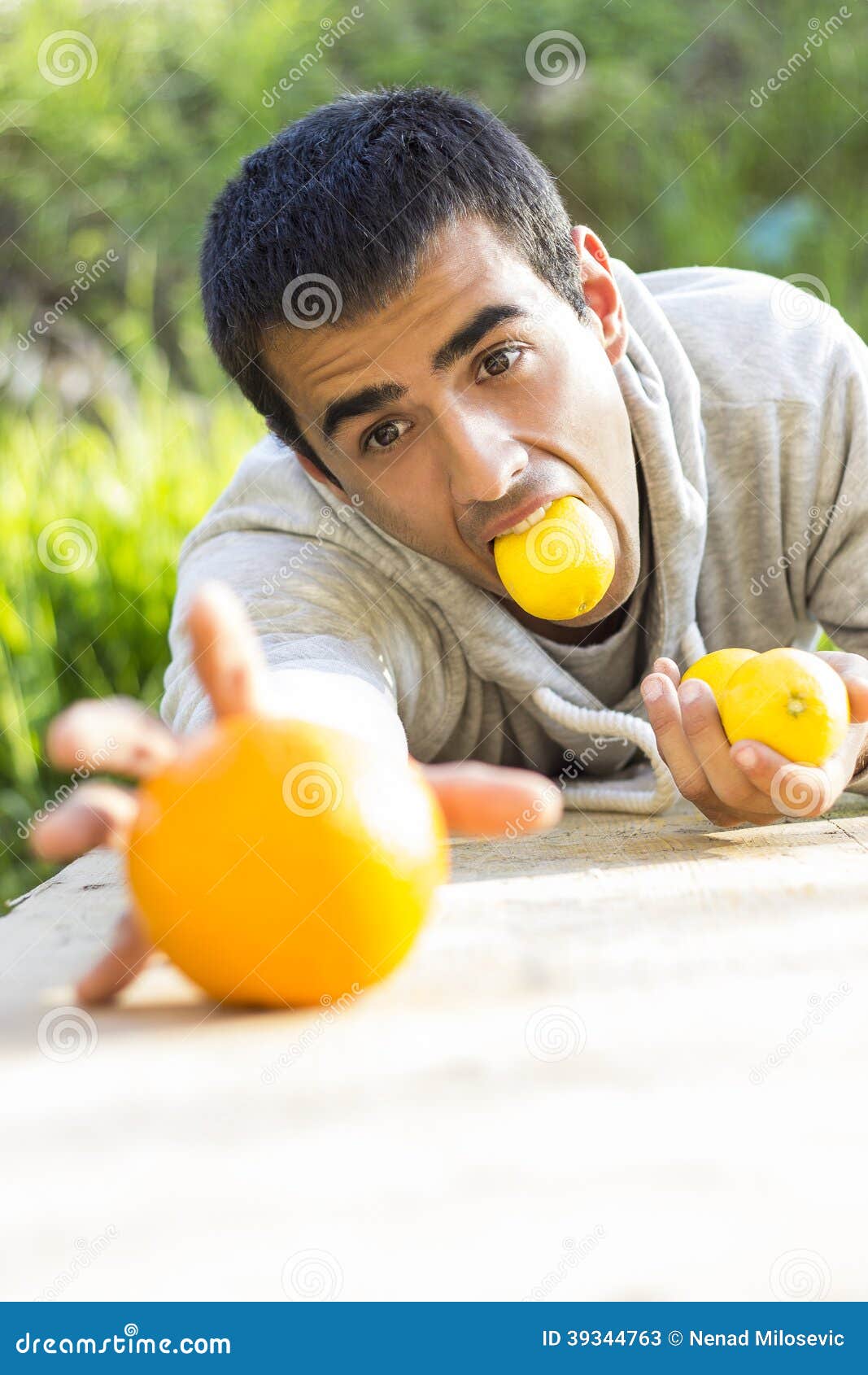 Man holding an orange stock image. Image of catch, casual - 39344763