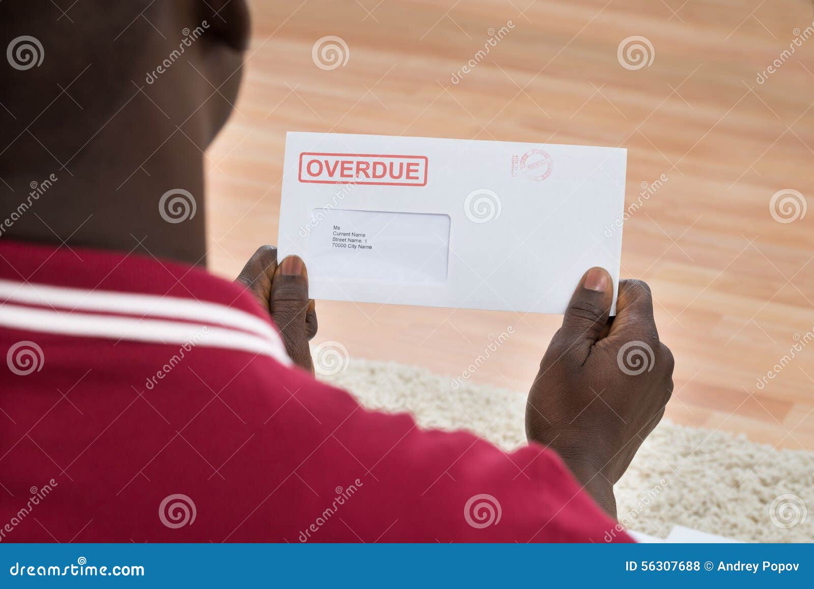 Man Holding Overdue Notice stock photo. Image of credit - 56307688