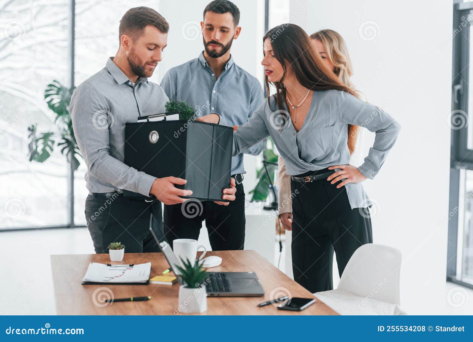 Man Holding Package. Group of Business People that Working on the ...