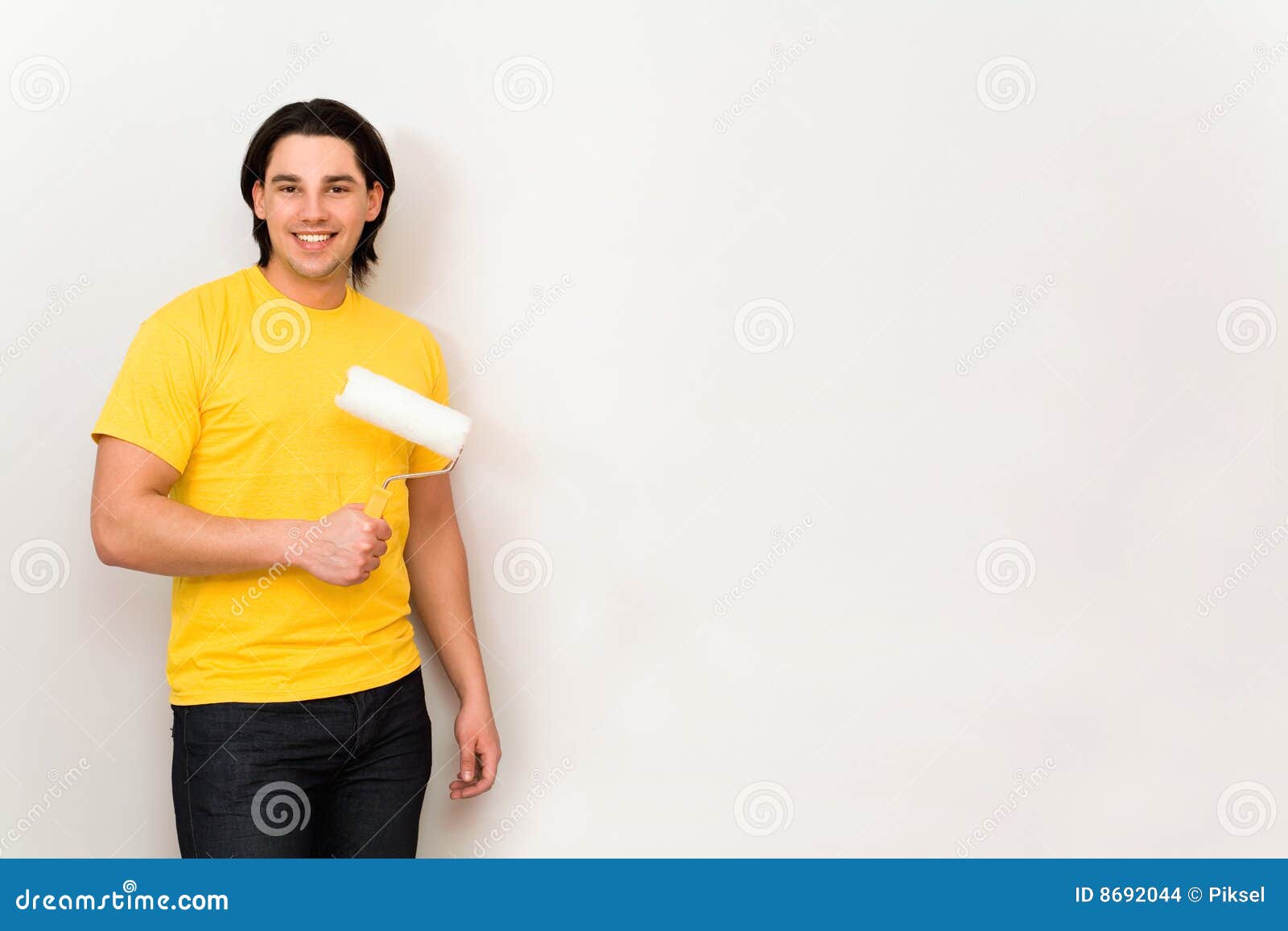 Man holding paint roller stock photo. Image of standing - 8692044