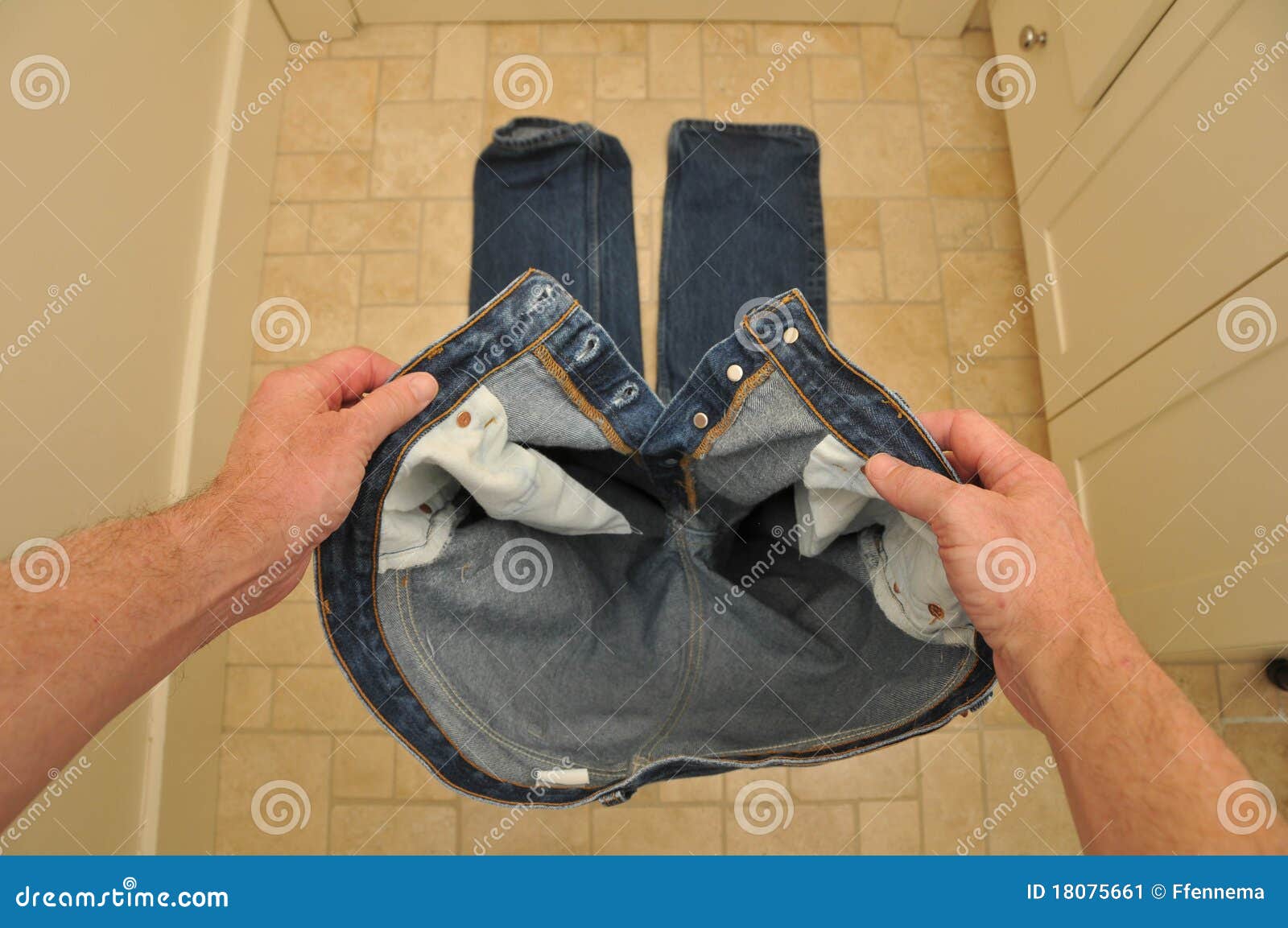 Man Holding Pants before Putting Them on Stock Image - Image of male ...