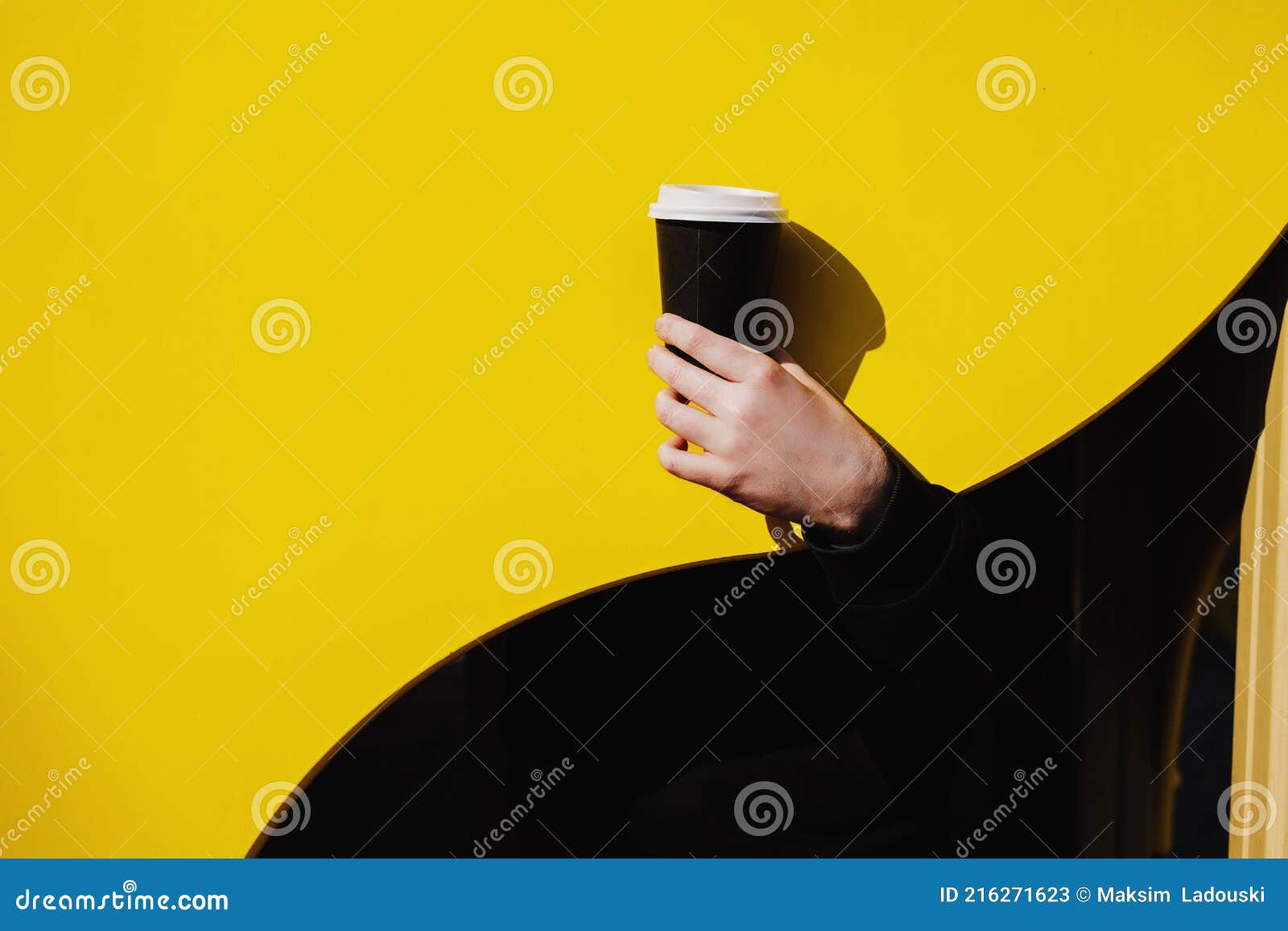 Man is holding paper cup stock image. Image of wall - 216271623