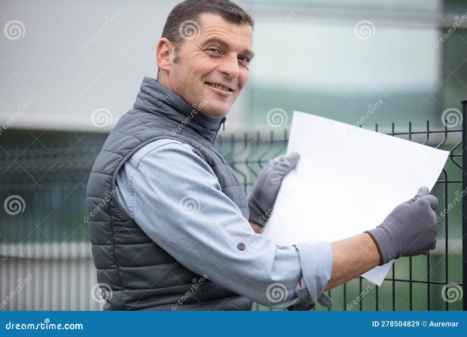 Man Holding Paperwork for Installing Fence Stock Image - Image of ...