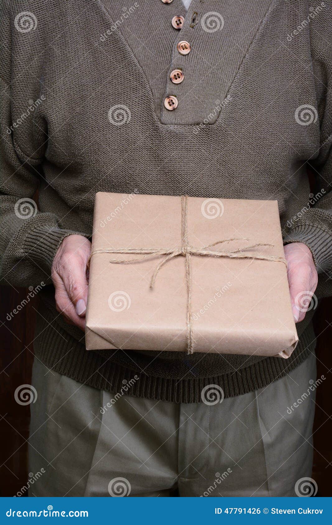 Man Holding Parcel stock photo. Image of present, paper - 47791426