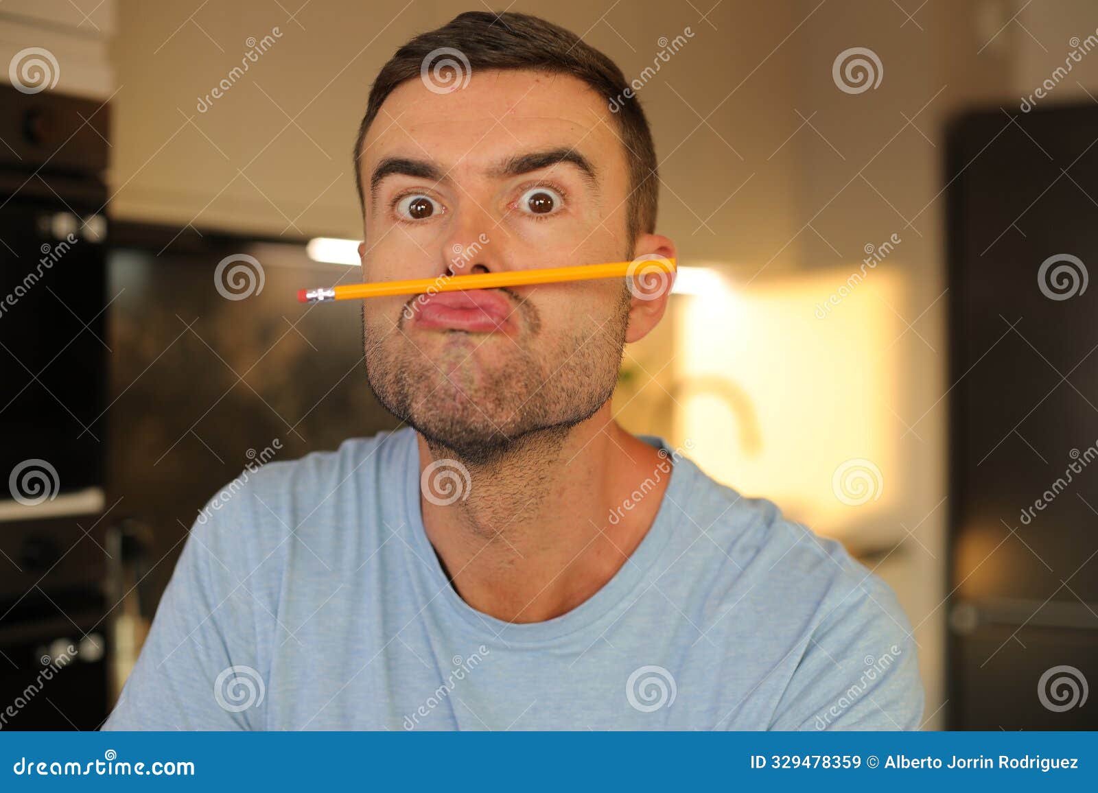 Man Holding a Pencil between His Lips and His Nose Stock Image - Image ...