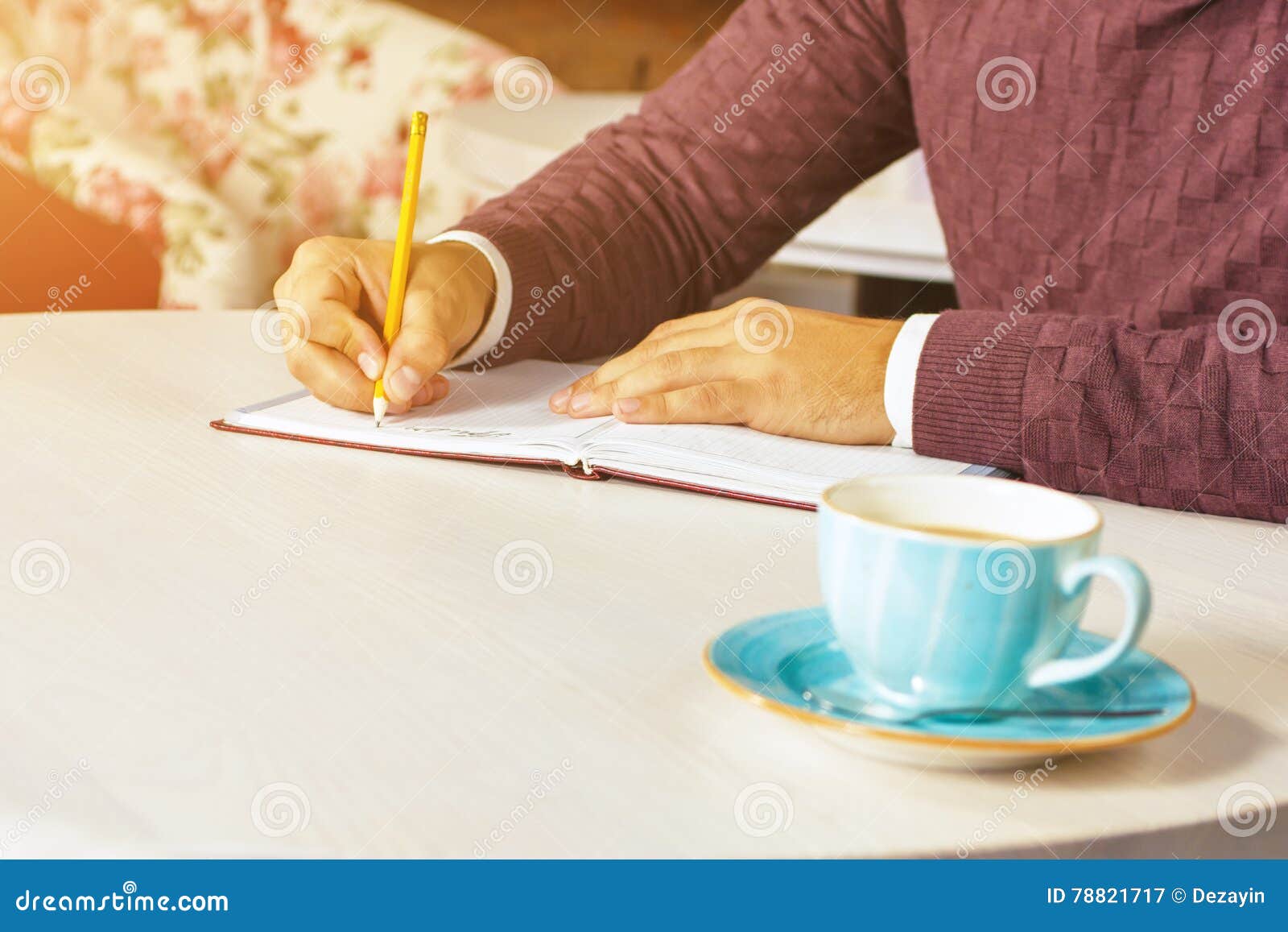 Man Holding Pencil and Writing on a Paper in the Diary Stock Image ...
