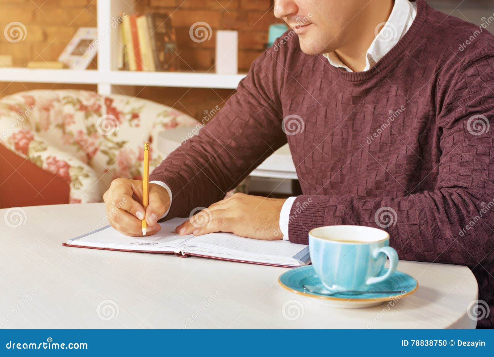 Man Holding Pencil and Writing on a Paper in the Diary Stock Photo ...