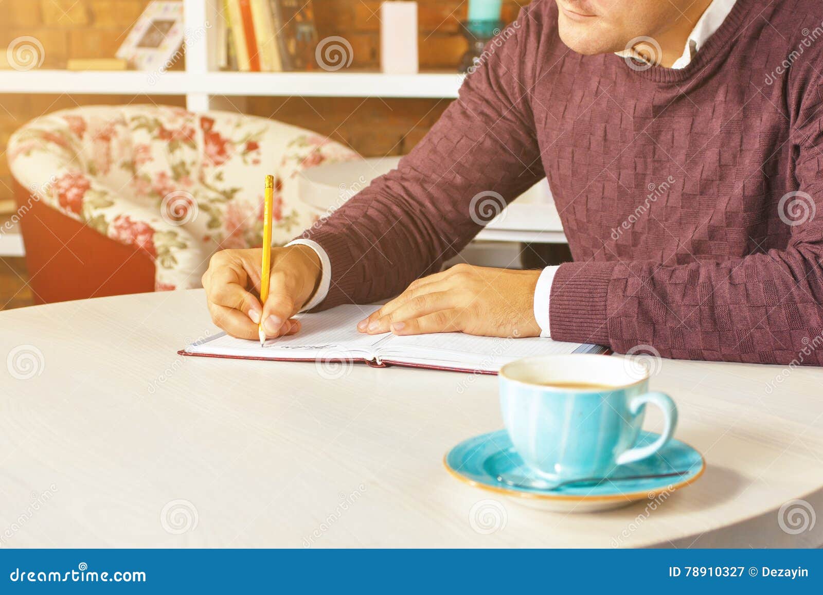 Man Holding Pencil and Writing on a Paper in the Diary Stock Image ...