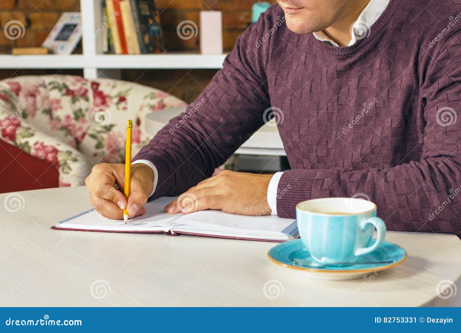 Man Holding Pencil and Writing on a Paper in the Diary Stock Image ...
