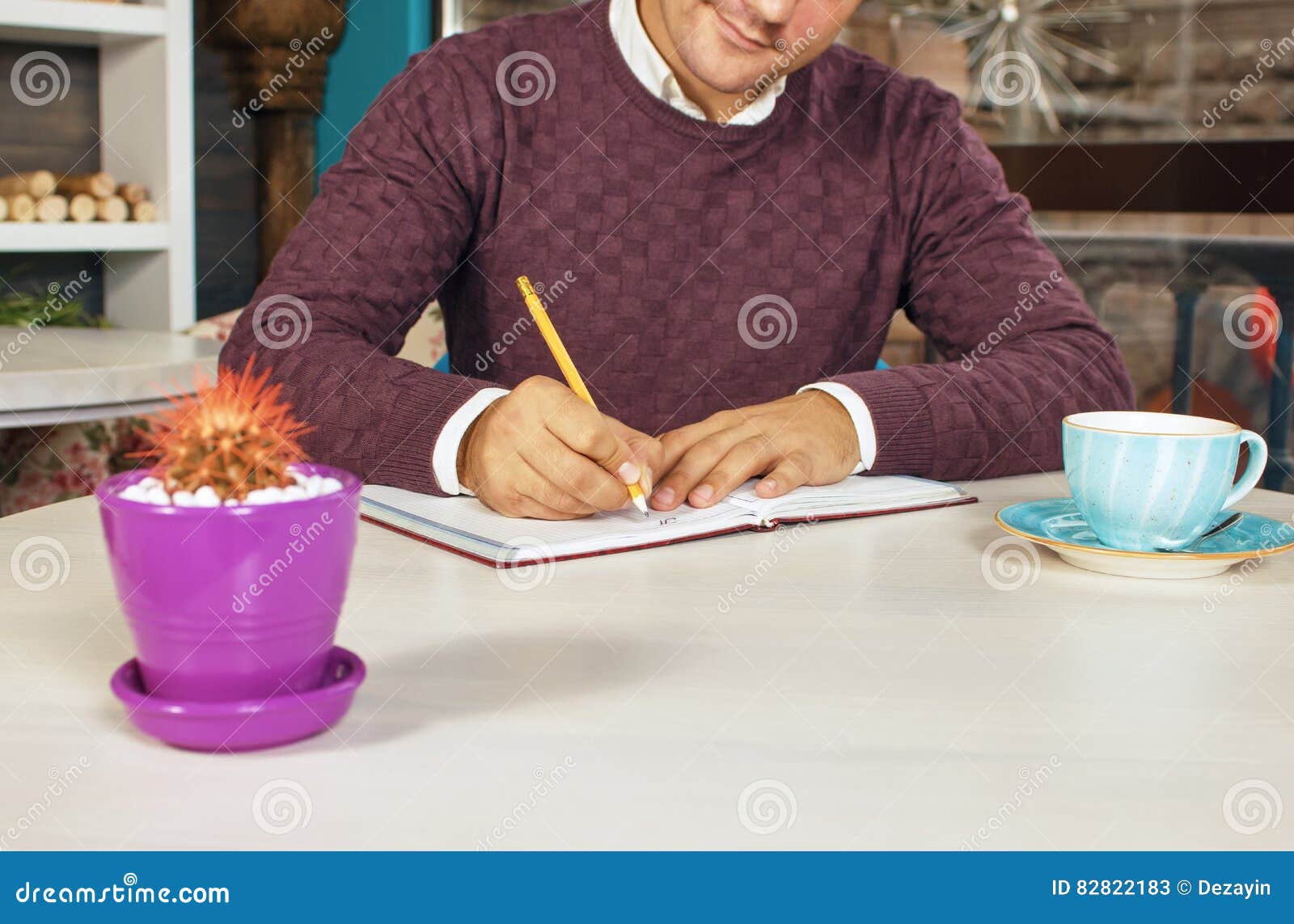 Man Holding Pencil and Writing on a Paper in the Diary Stock Image ...