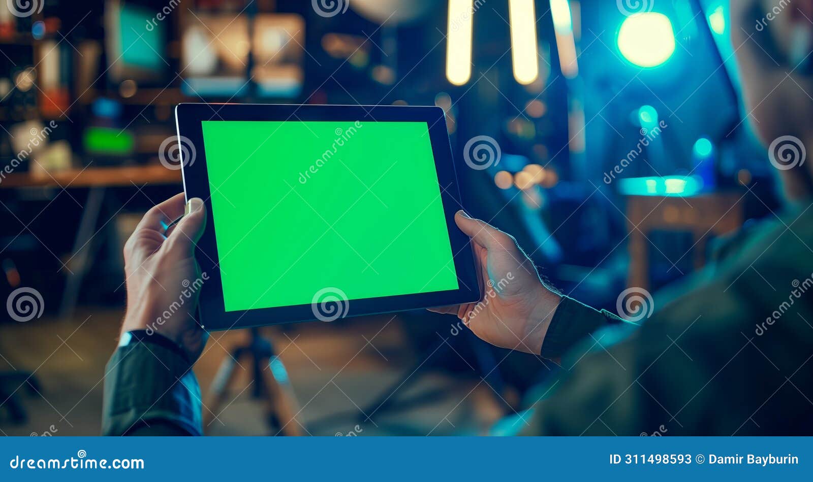A Man is Holding a Personal Computer with a Green Screen Stock ...