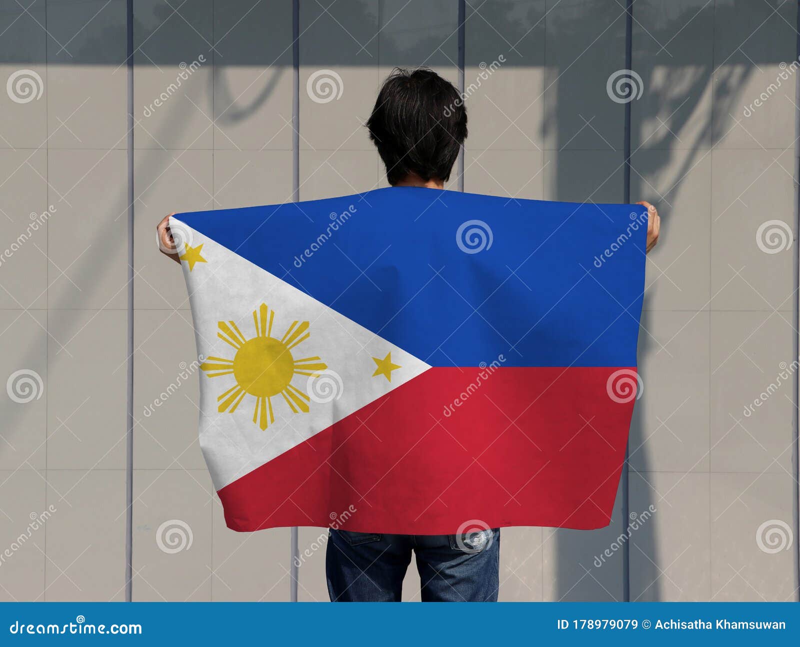 The Man Holding Philippines Flag on His Shoulder and Turn Back on Grey ...