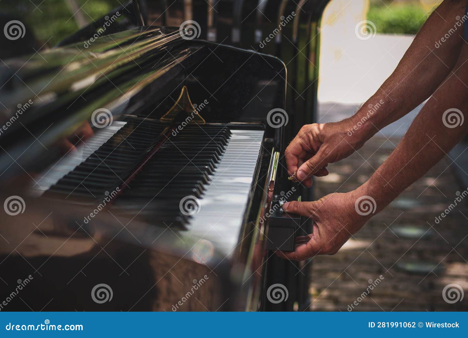 Man Holding a Piano Lock Key. Stock Photo - Image of performance ...