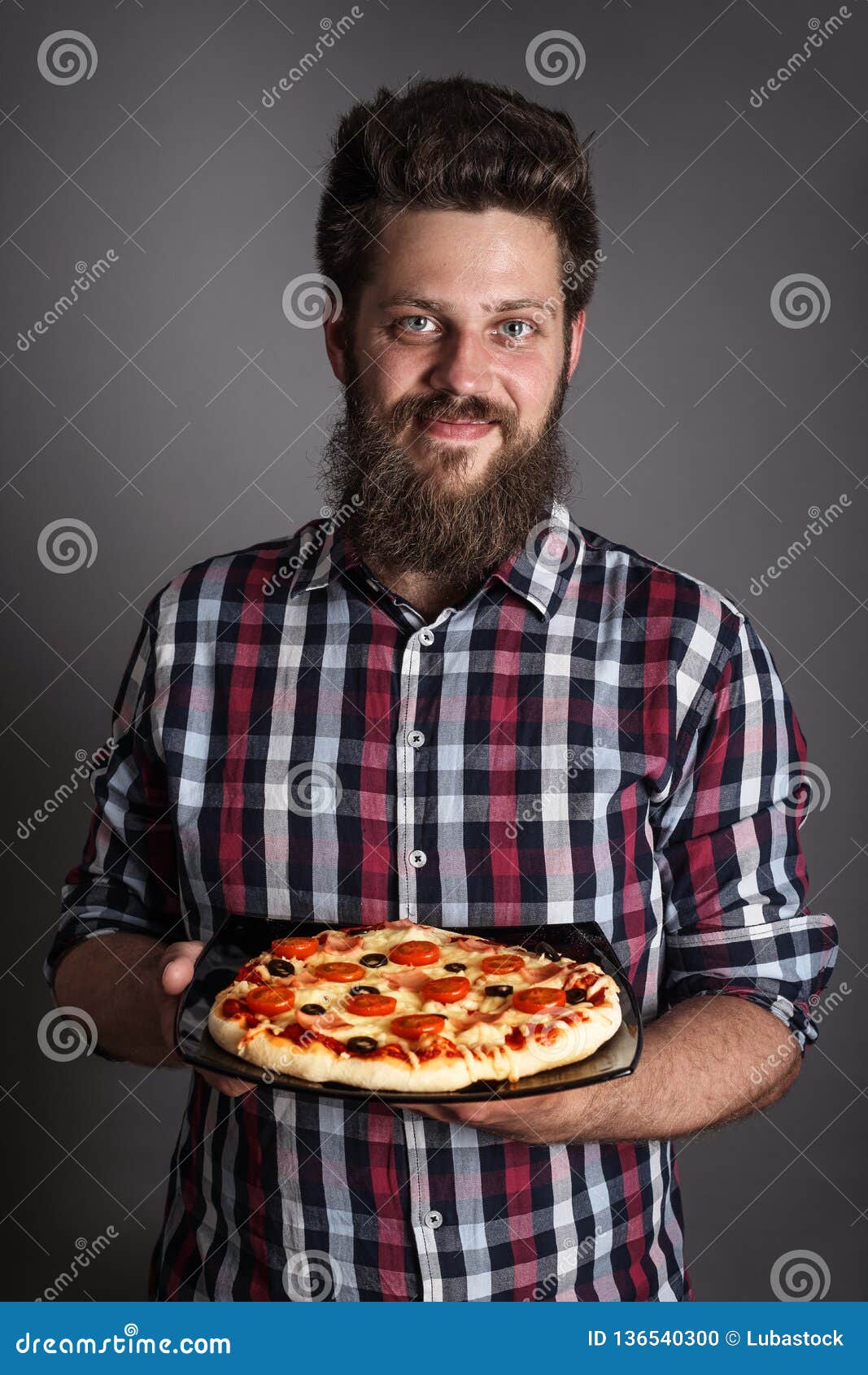 Man holding pizza stock photo. Image of cooking, bearded - 136540300