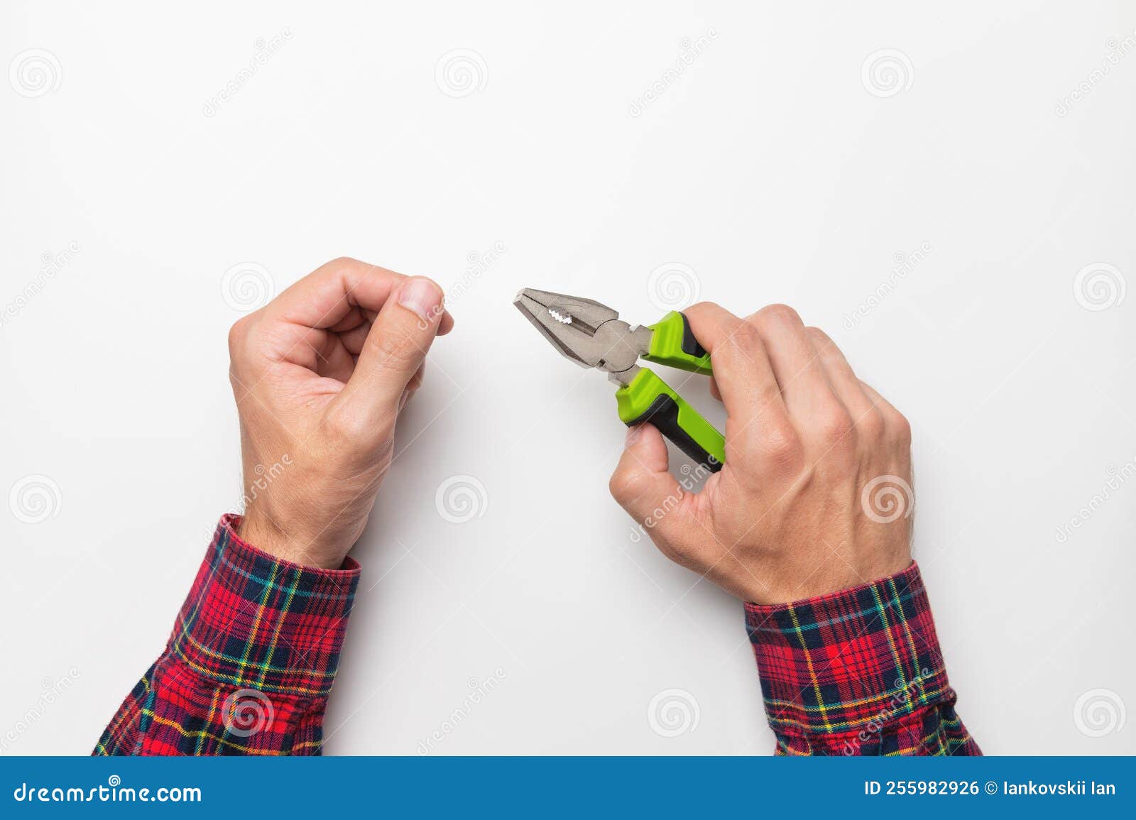 Man Holding Pliers in His Hand on a White Background Stock Photo ...