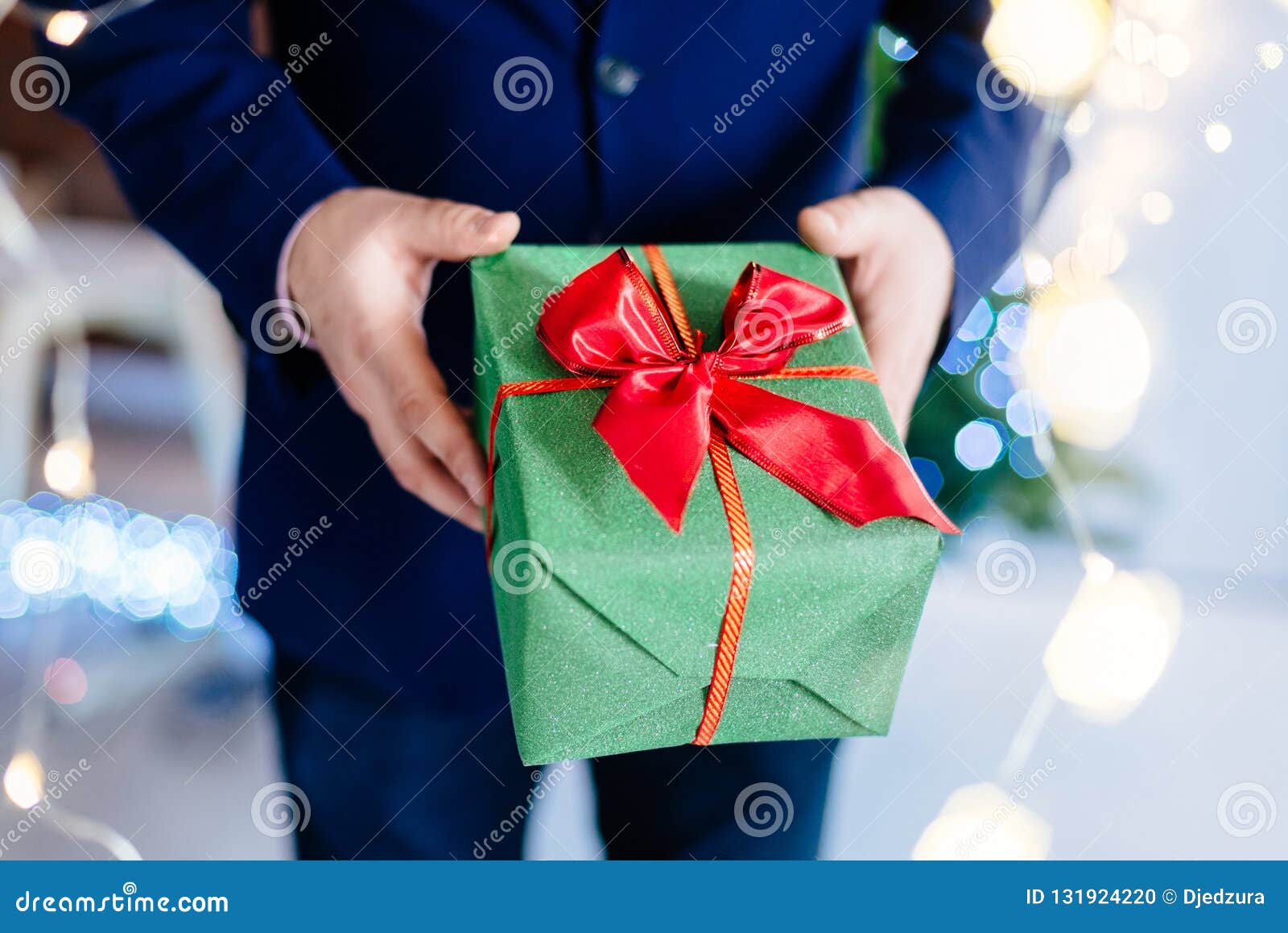 Man Holding Present in Hand Stock Photo - Image of valentines, holiday ...