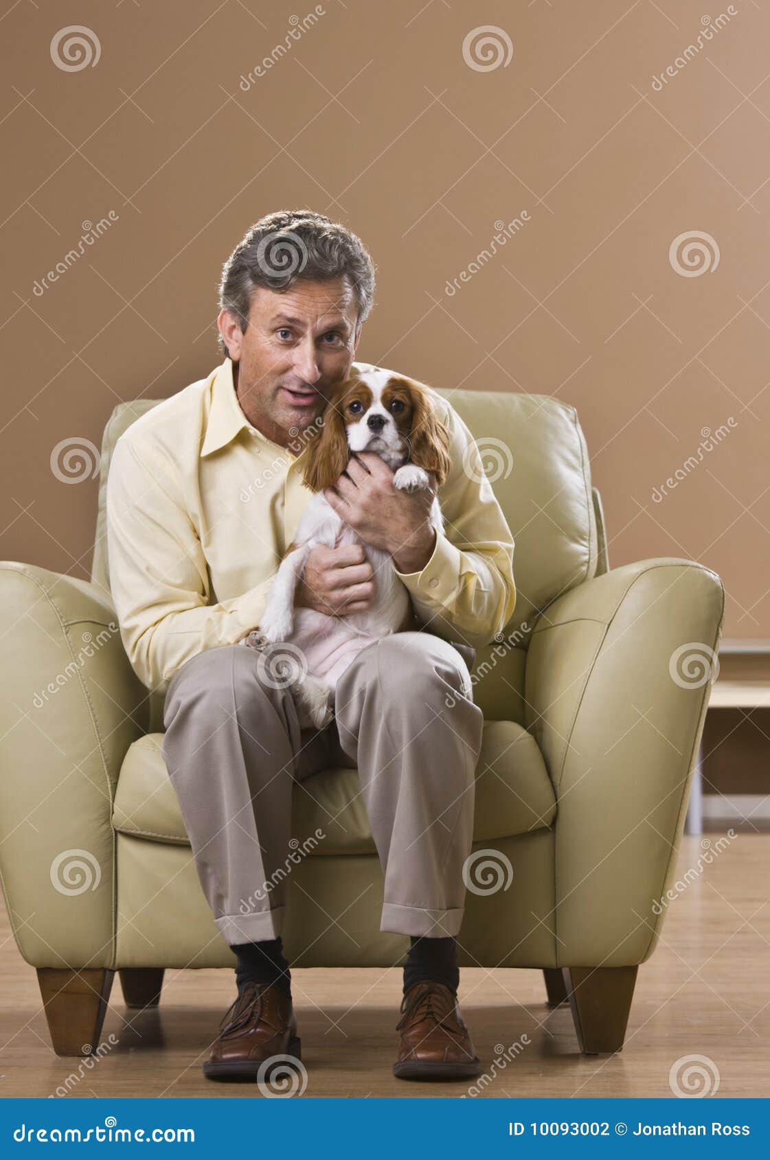 Man Holding Puppy stock photo. Image of forties, white - 10093002