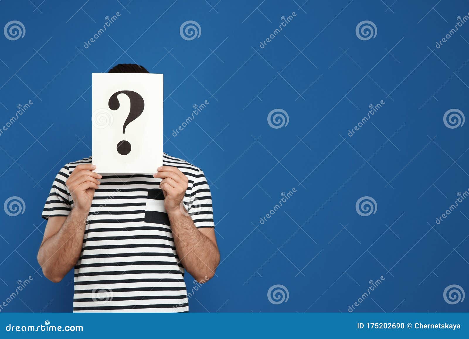 Man Holding Question Mark Sign on Background. Space for Text Stock ...