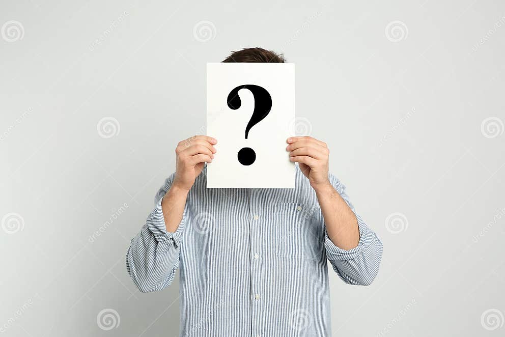 Man Holding Question Mark Sign on Background Stock Photo - Image of ...