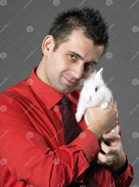Man holding rabbit stock photo. Image of rabbit, business - 13690968