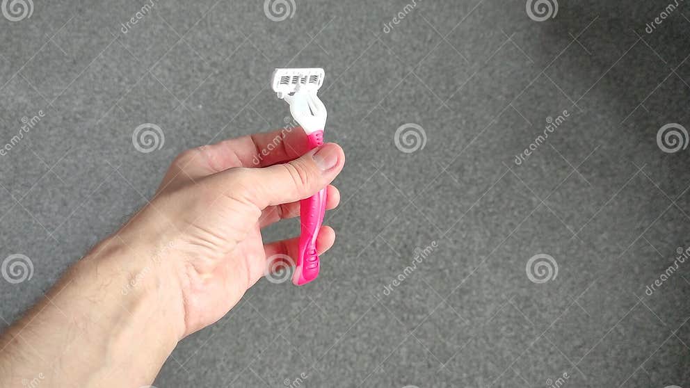 Man Holding a Razor in His Left Hand Stock Photo - Image of model ...