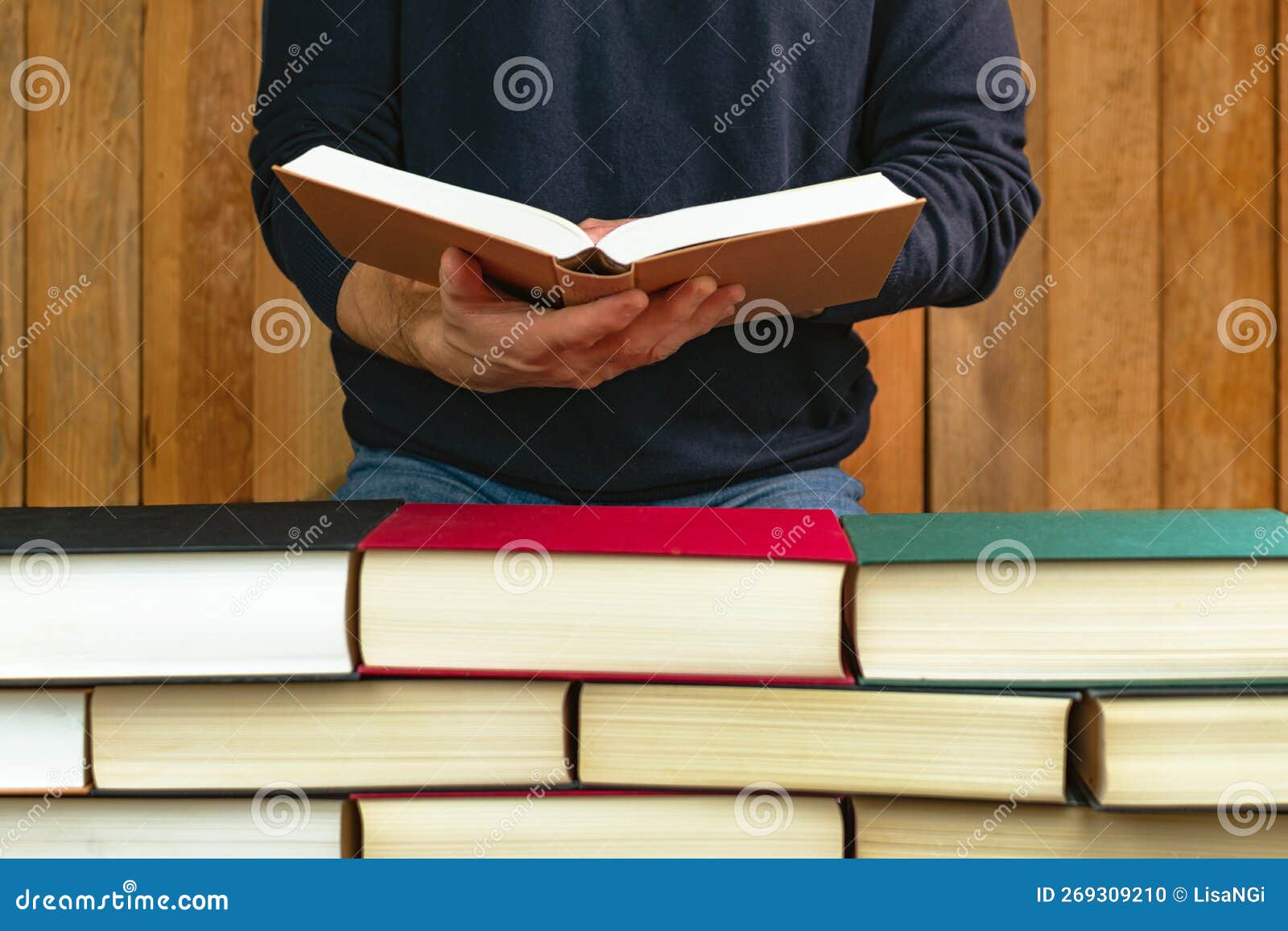 Man Holding and Reading a Book Stock Photo - Image of clean, advertise ...