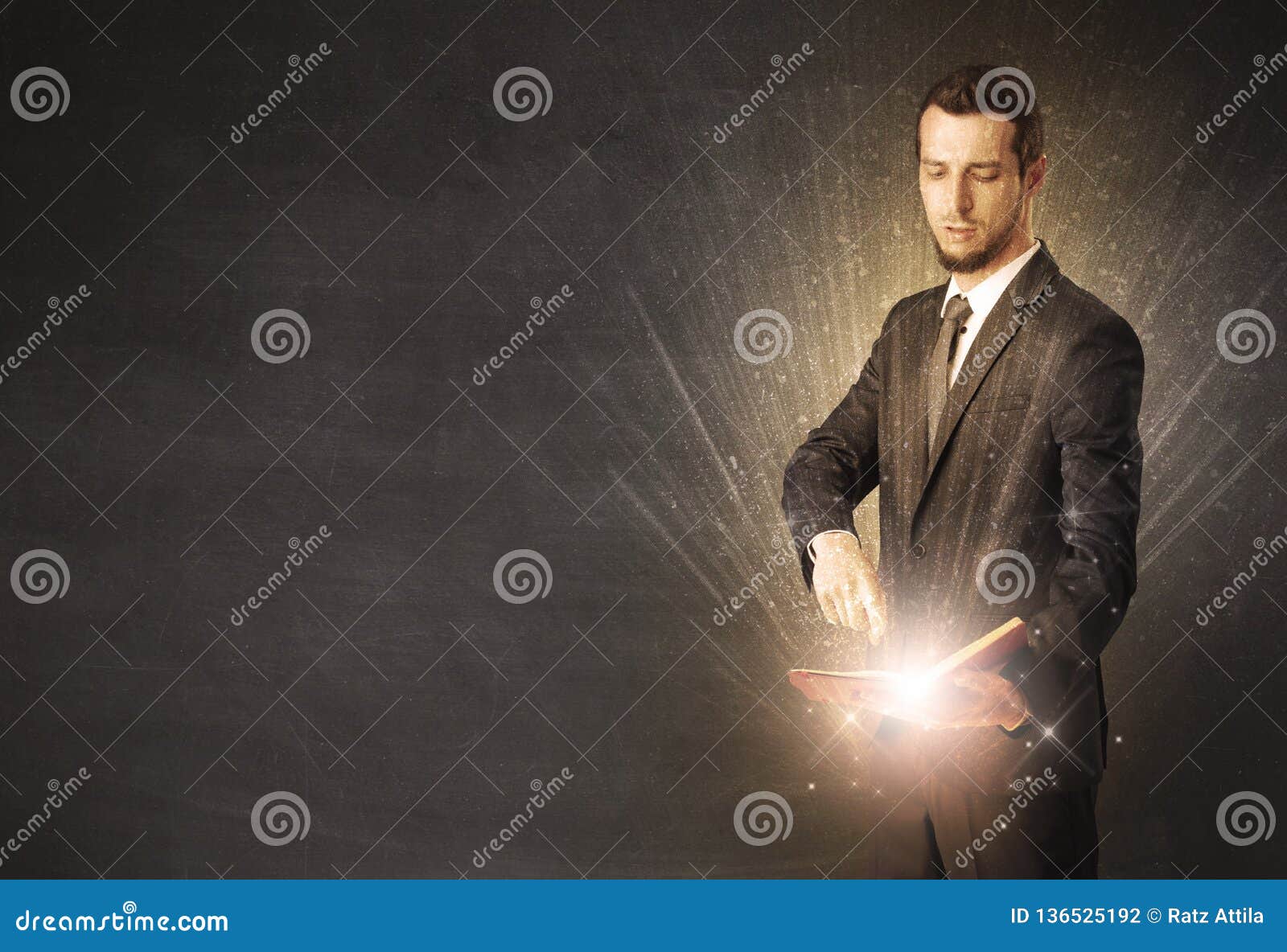 Man holding a book. stock photo. Image of looking, open - 136525192