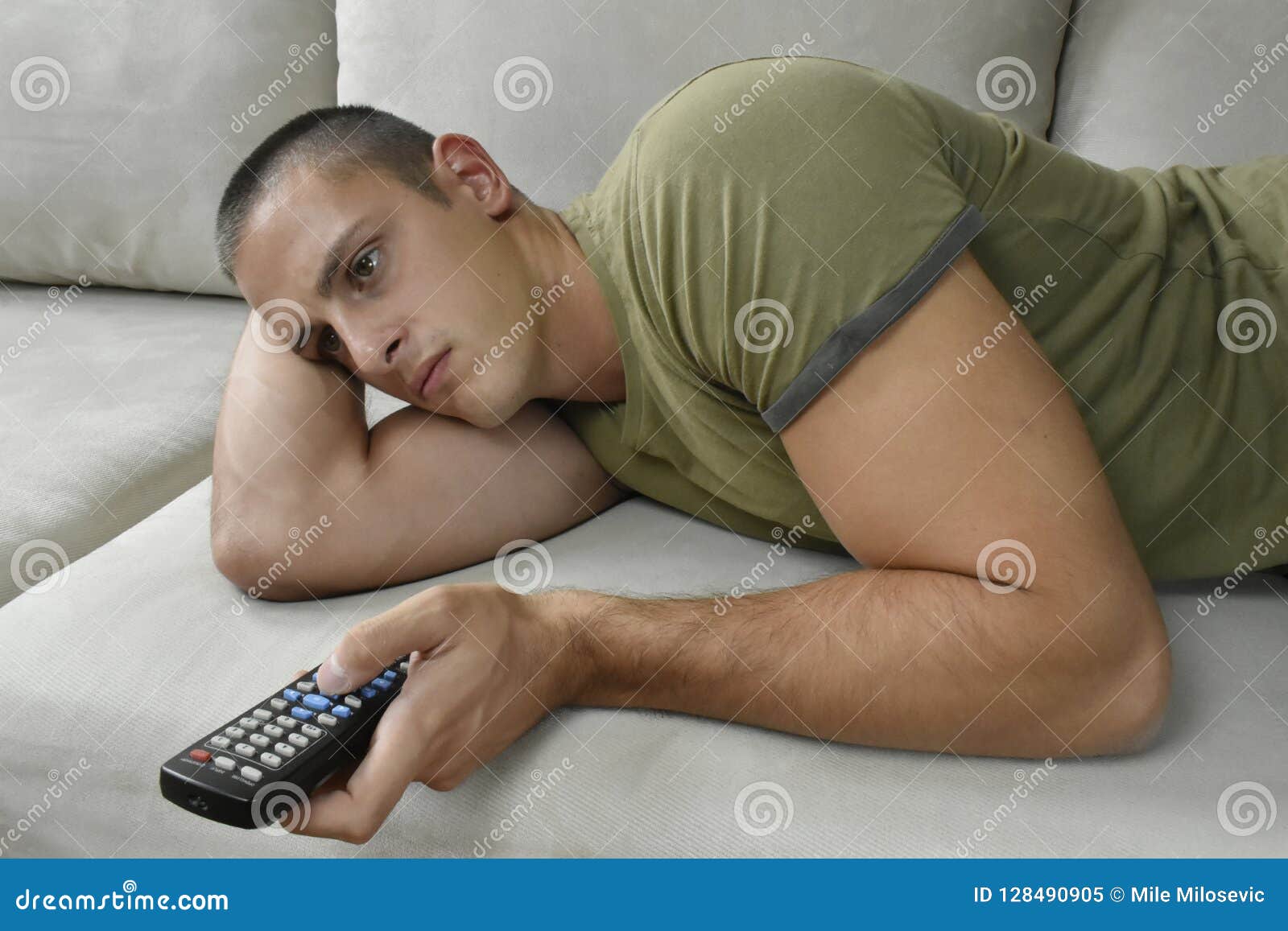 Man holding remote control stock image. Image of vatching - 128490905