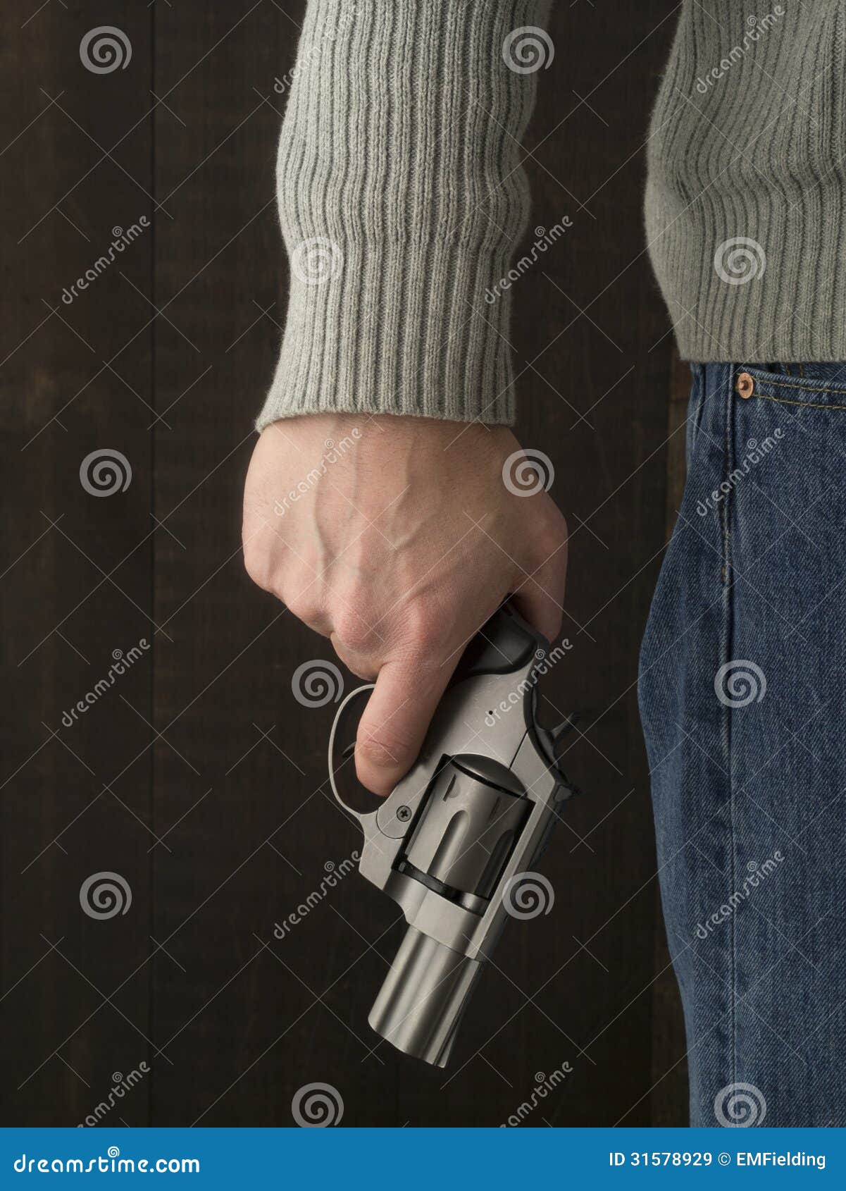 Man holding a revolver stock image. Image of revolver - 31578929