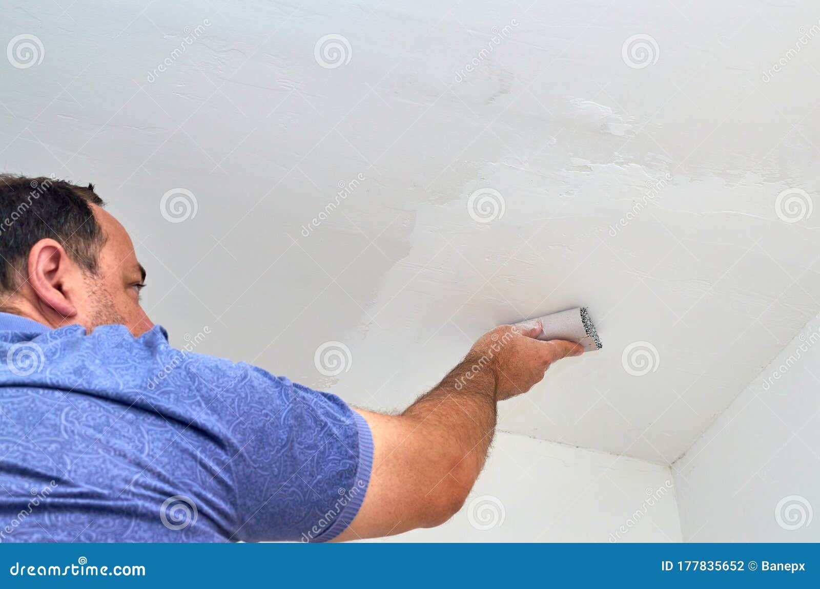 Polishing a ceiling stock photo. Image of plasterer - 177835652