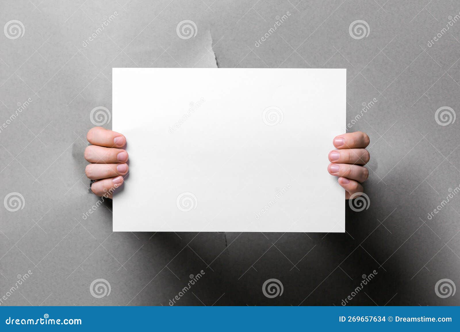 Man Holding Sheet of Paper through Hole in White Paper, Closeup. Mockup ...