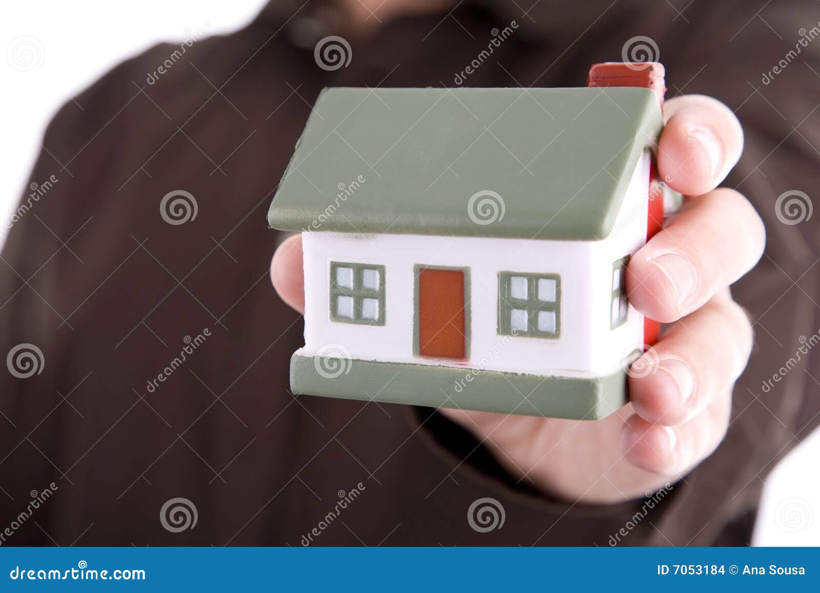 Man holding a small house stock photo. Image of property - 7053184