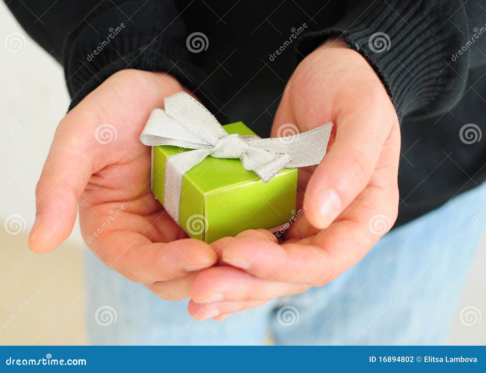 Man holding small present stock photo. Image of holidays - 16894802