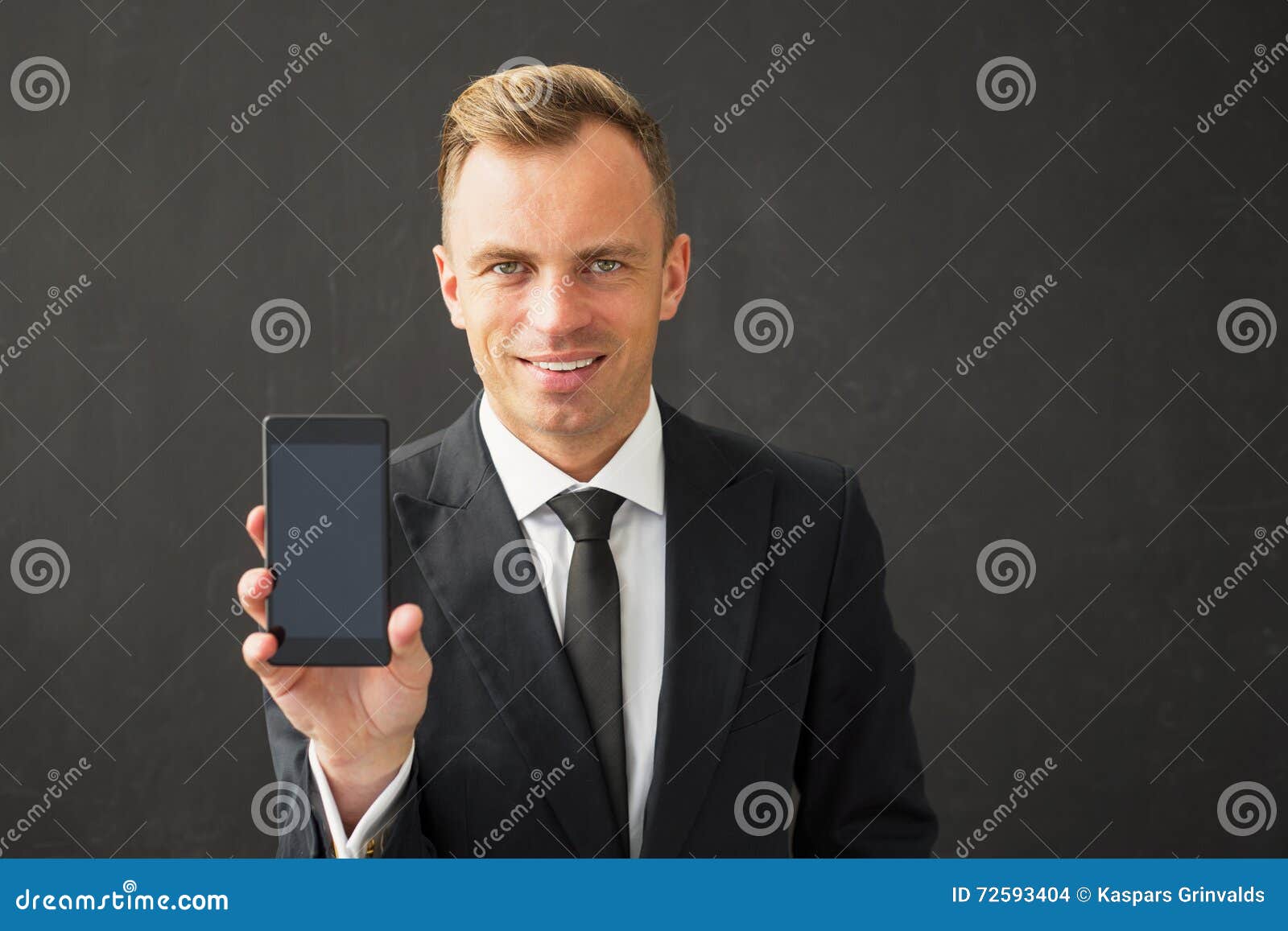 Man holding smartphone stock photo. Image of equipment - 72593404