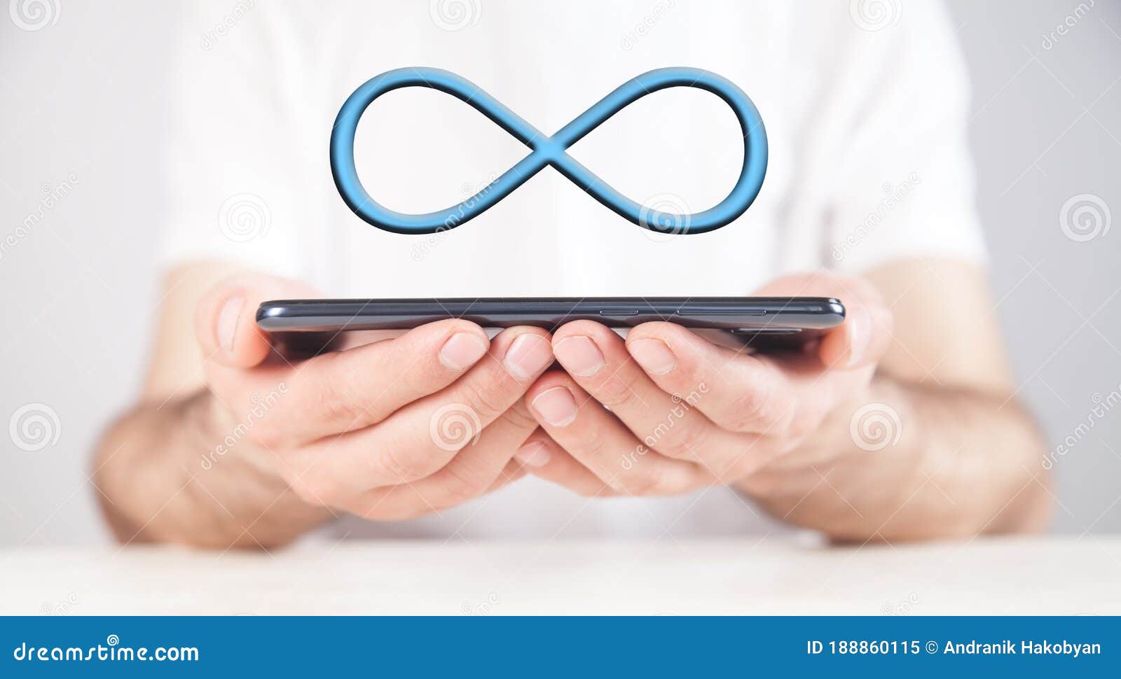 Man Holding Smartphone with a Infinity Symbol Stock Image - Image of ...