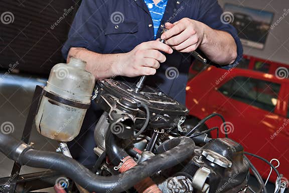 Man Holding a Spanner Over a Car Engine Stock Image - Image of people ...