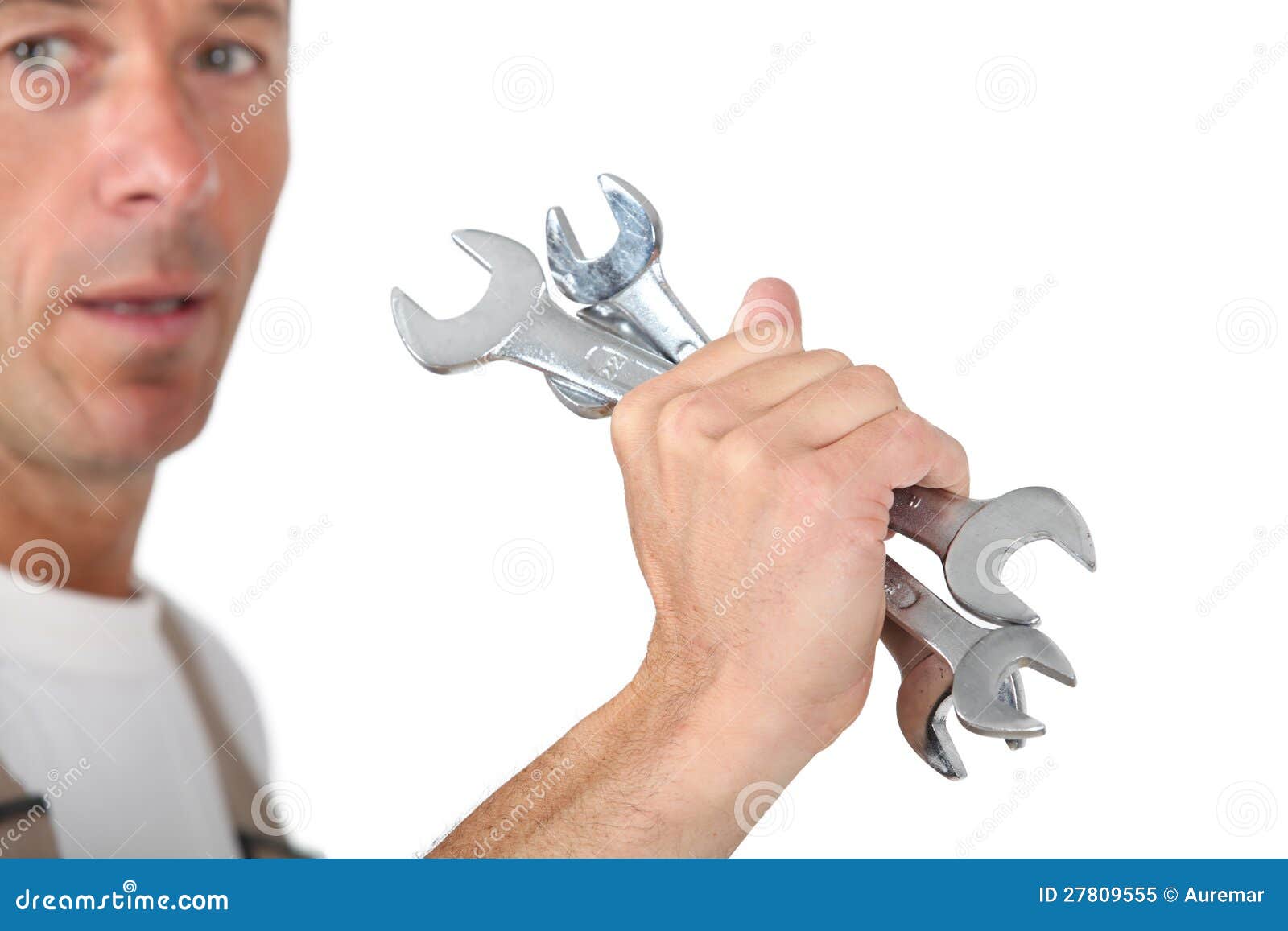 Man holding spanners stock image. Image of frontview - 27809555