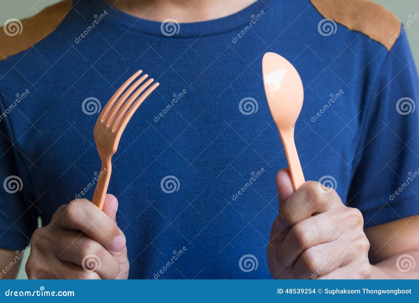 Man holding spoon and fork stock photo. Image of human - 48539254