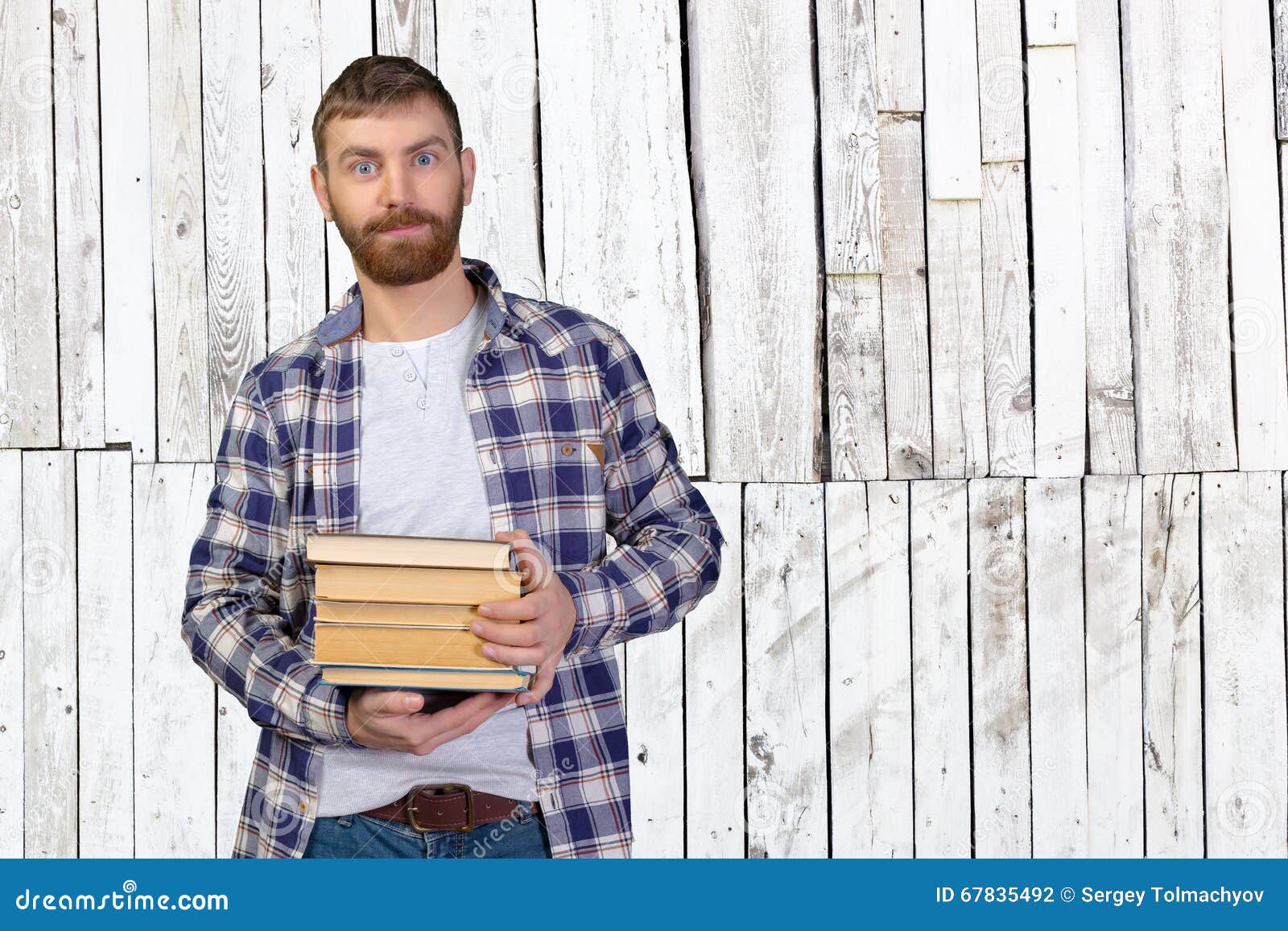 Man Holding Stack of Books stock photo. Image of literature - 67835492