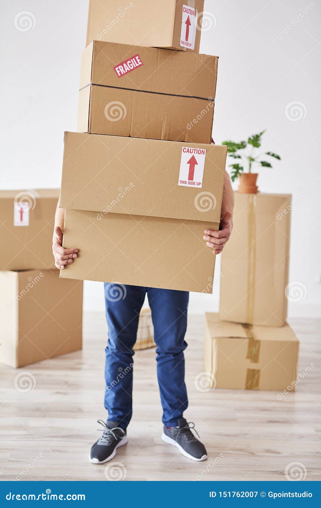 Man Holding Stack of Boxes in Front of His Face Stock Image - Image of ...