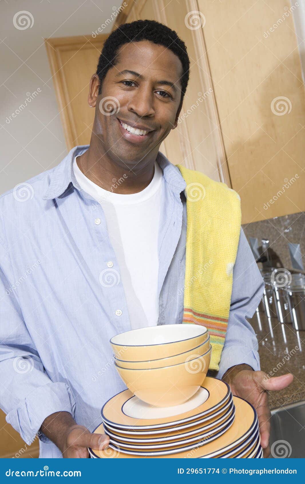 Man Holding Stack of Washed Plates Stock Photo - Image of interior ...