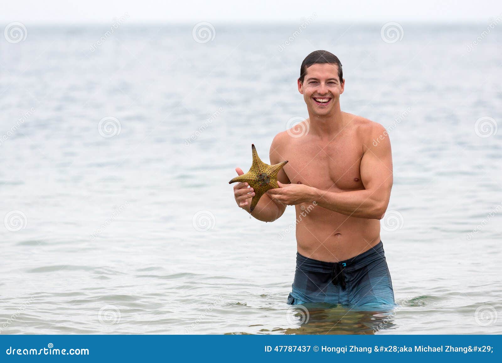 Man holding starfish stock image. Image of enjoyment - 47787437