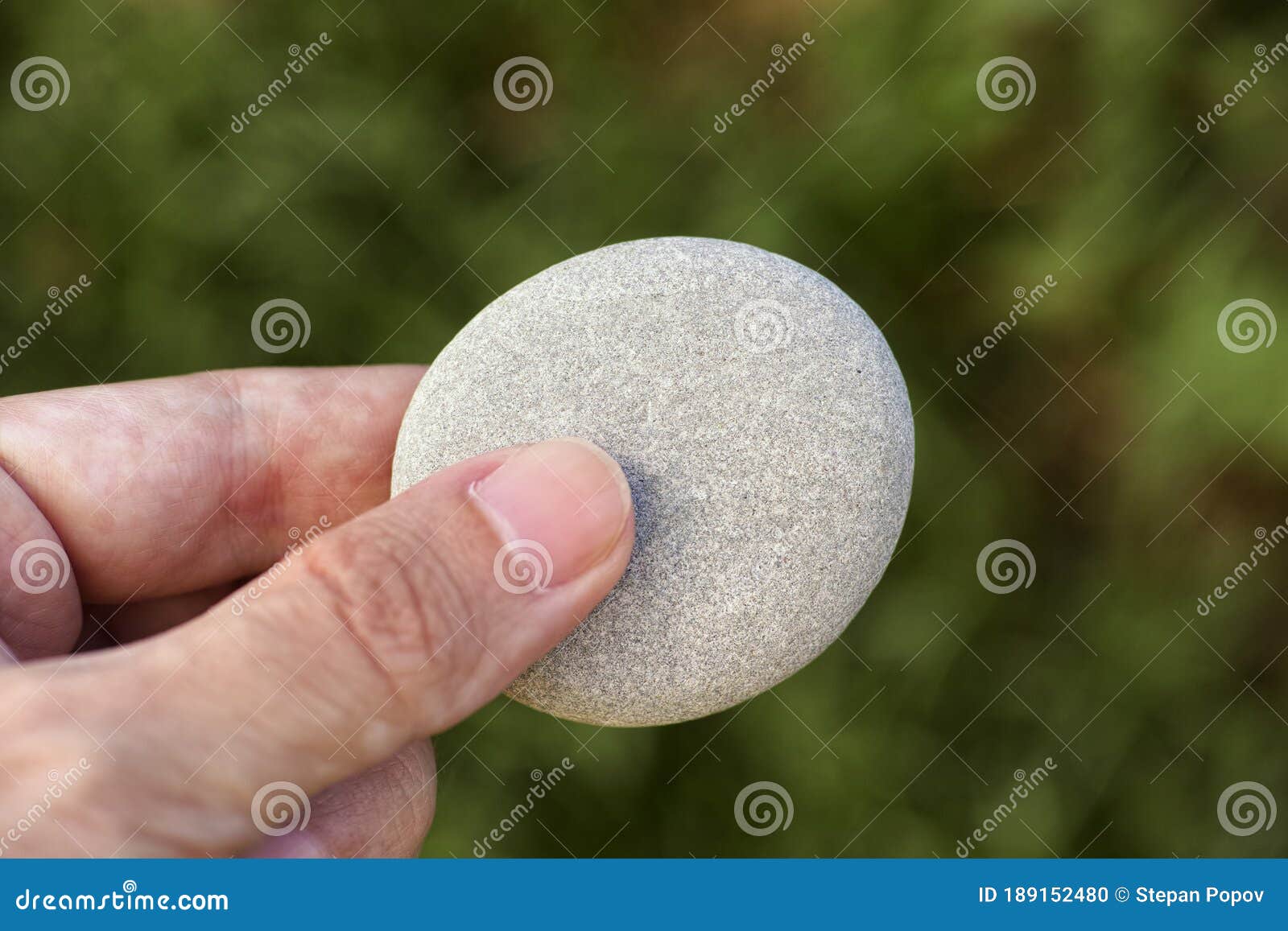 Man Holding a Stone in His Hand Stock Photo - Image of flat, rocky ...