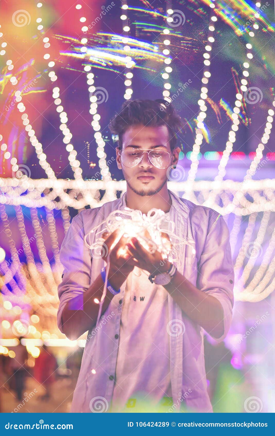 Man Holding String Light During Nighttime Picture. Image: 106424289