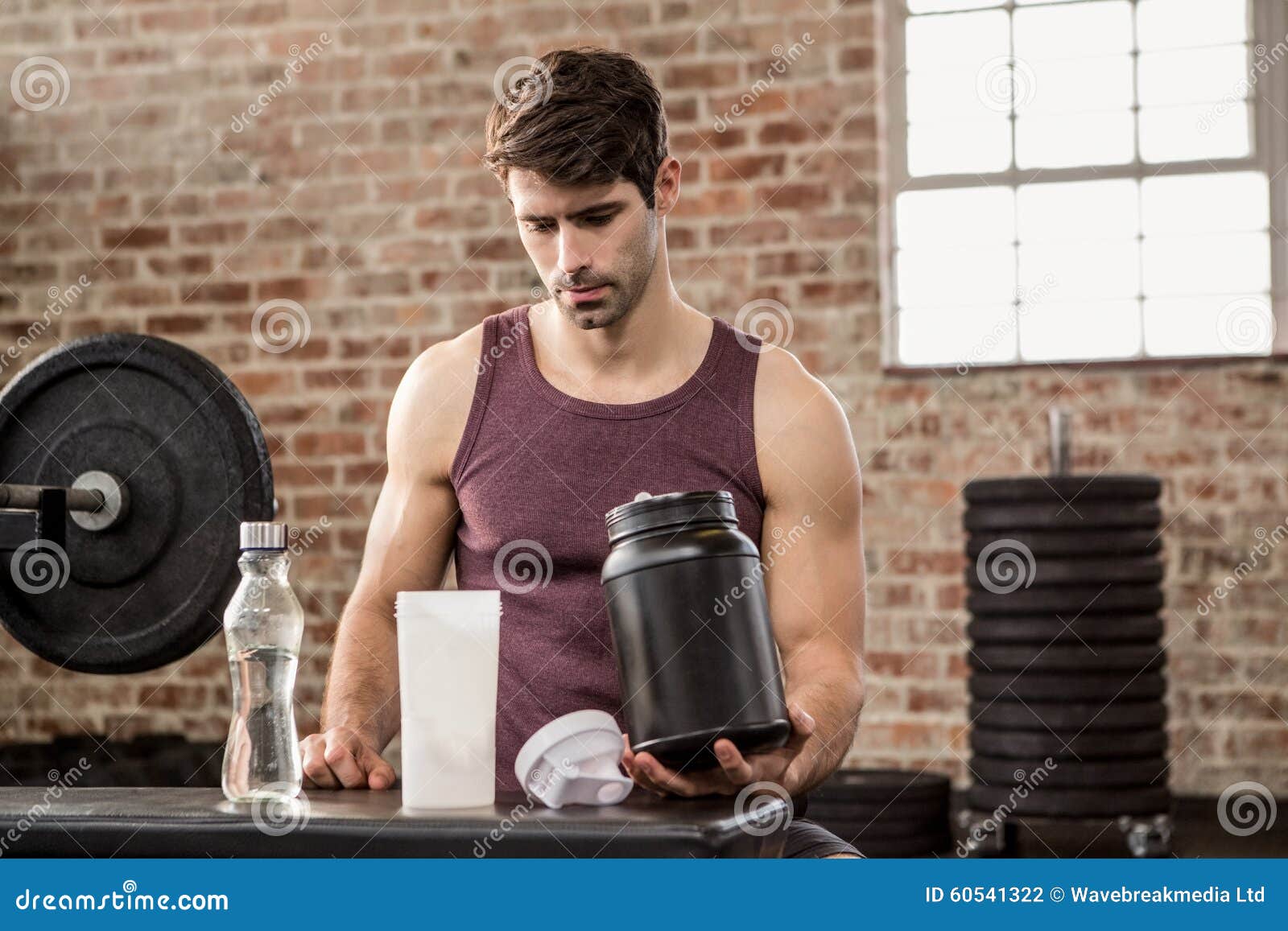 Man holding supplement tin stock photo. Image of front - 60541322