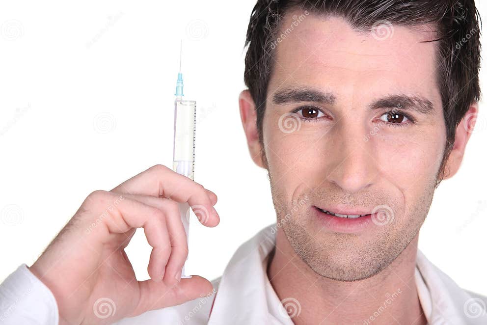 Man holding syringe stock photo. Image of medicine, medical - 29294248