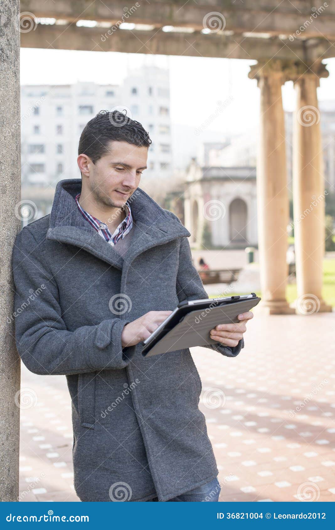 Man Holding Tablet Computer in the Park. Stock Photo - Image of ...