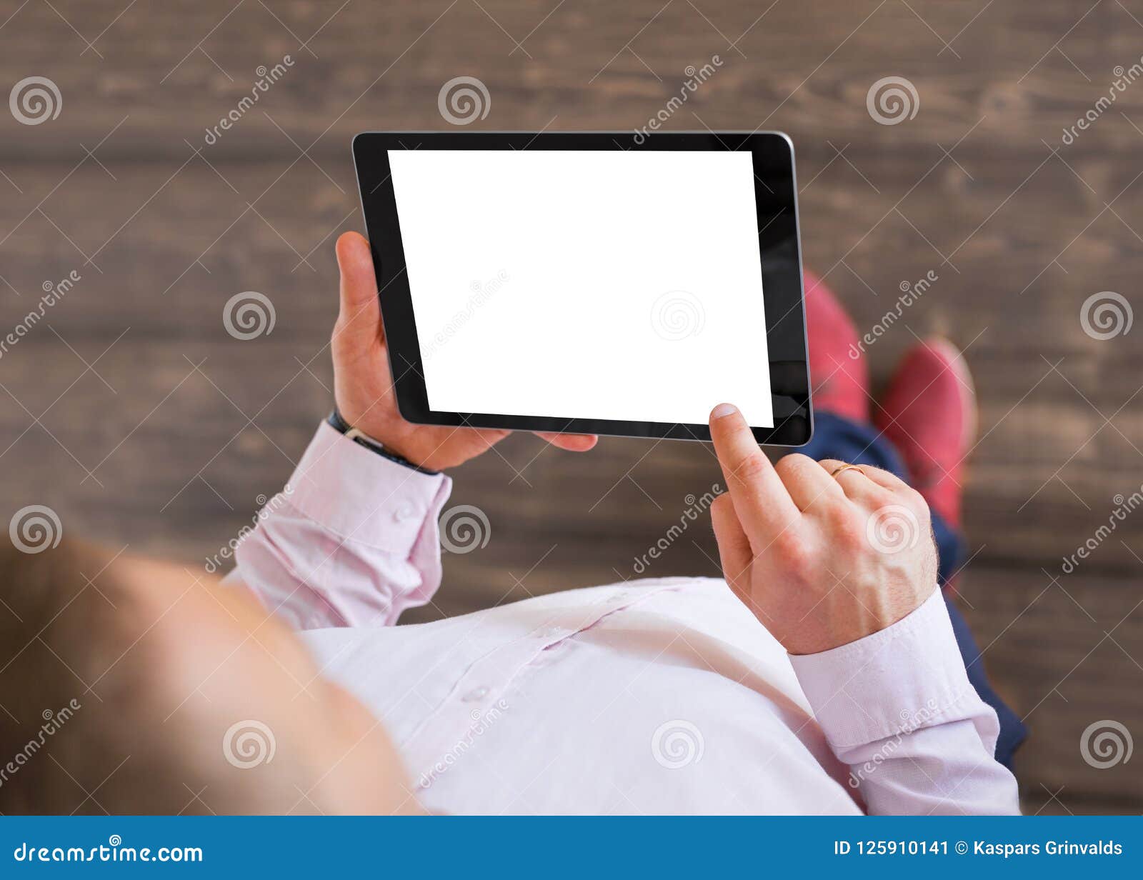 Man holding tablet. stock image. Image of home, news - 125910141